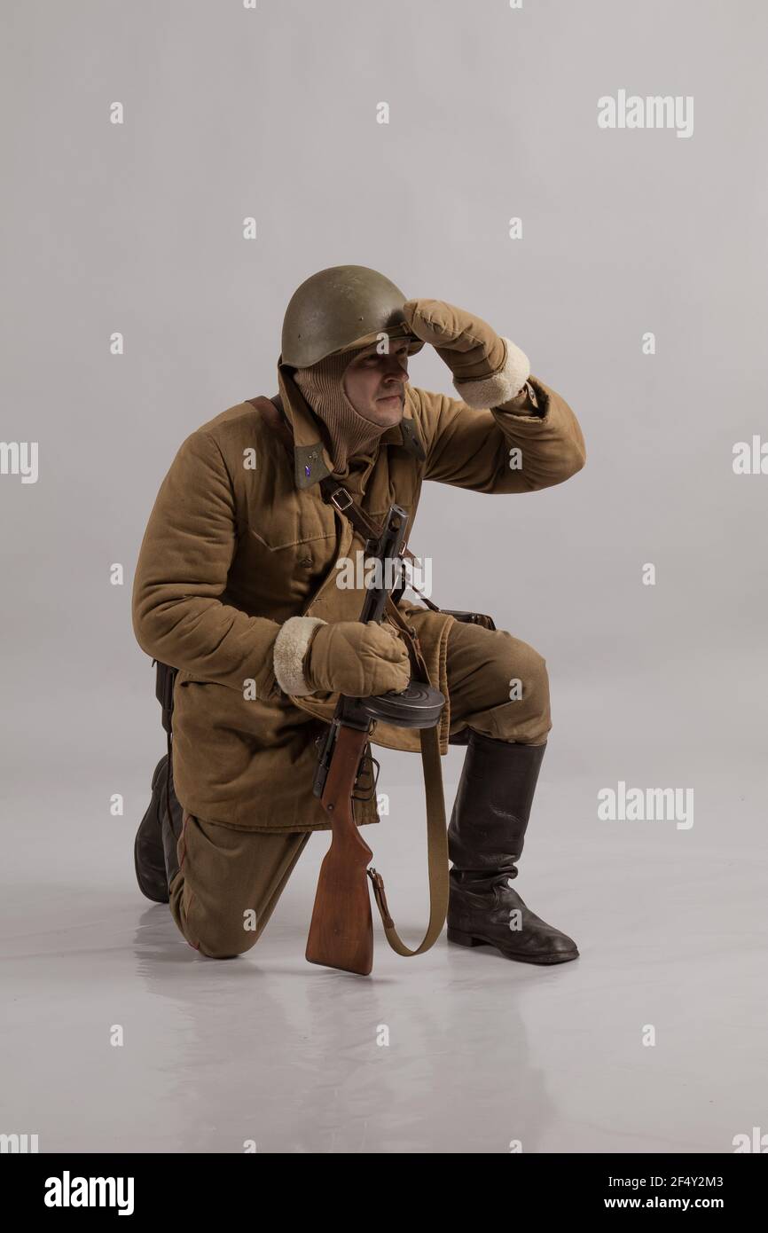 male actor in the winter military uniform of an officer of the Red Army ...