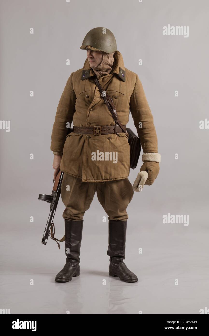 male actor in the winter military uniform of an officer of the Red Army ...