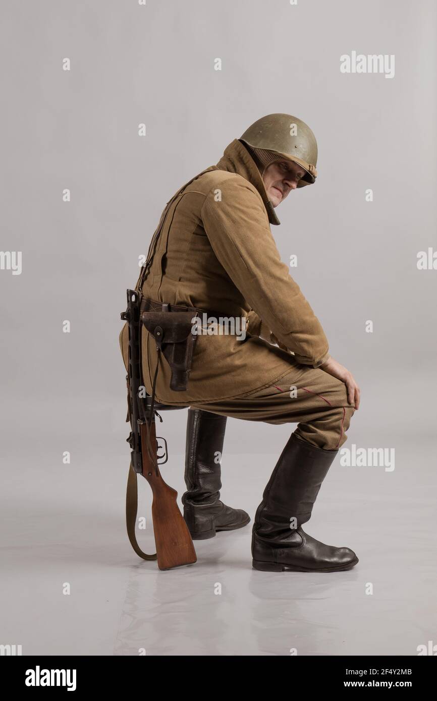 male actor in the winter military uniform of an officer of the Red Army ...