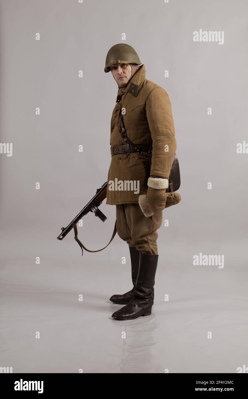 male actor in the winter military uniform of an officer of the Red Army ...