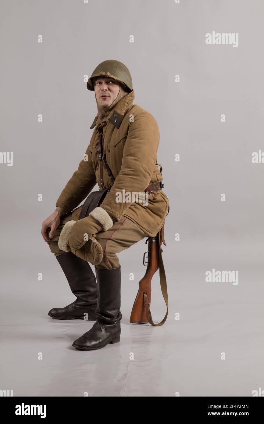 male actor in the winter military uniform of an officer of the Red Army ...