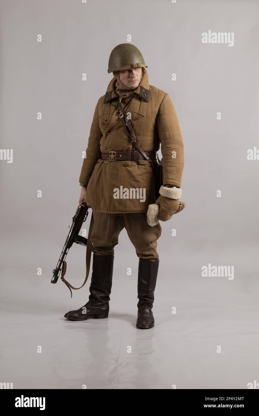 male actor in the winter military uniform of an officer of the Red Army ...