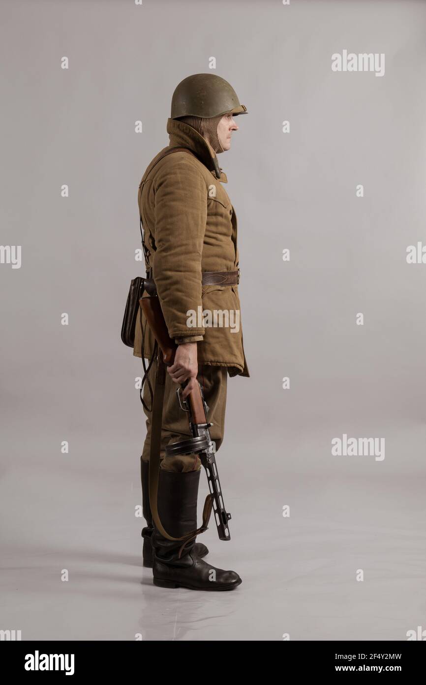 male actor in the winter military uniform of an officer of the Red Army ...