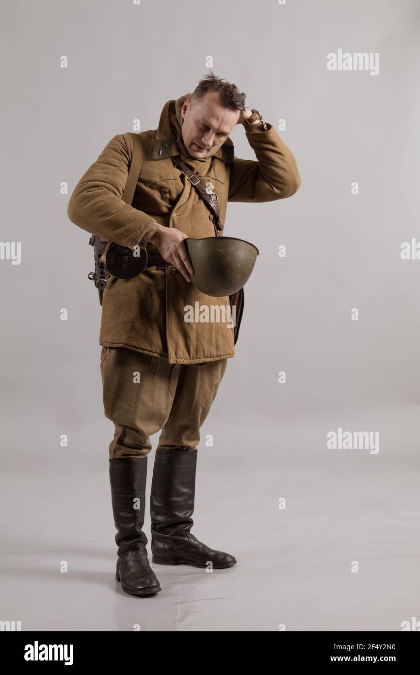 male actor in the winter military uniform of an officer of the Red Army ...