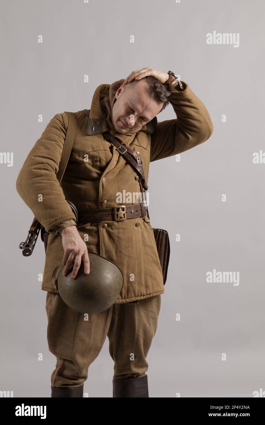 male actor in the winter military uniform of an officer of the Red Army ...
