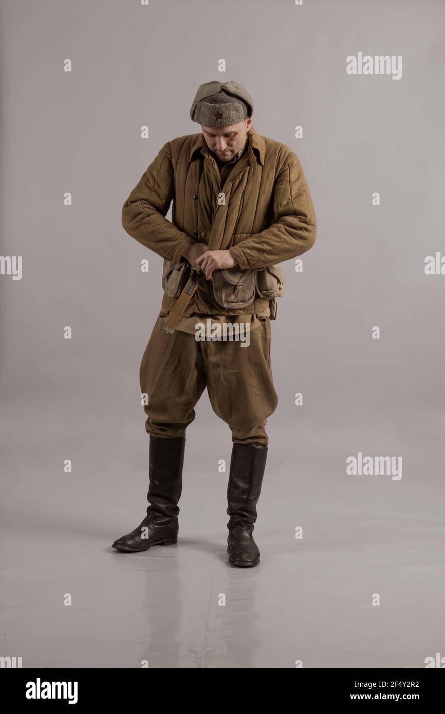male actor in the winter military uniform of an officer of the Red Army ...