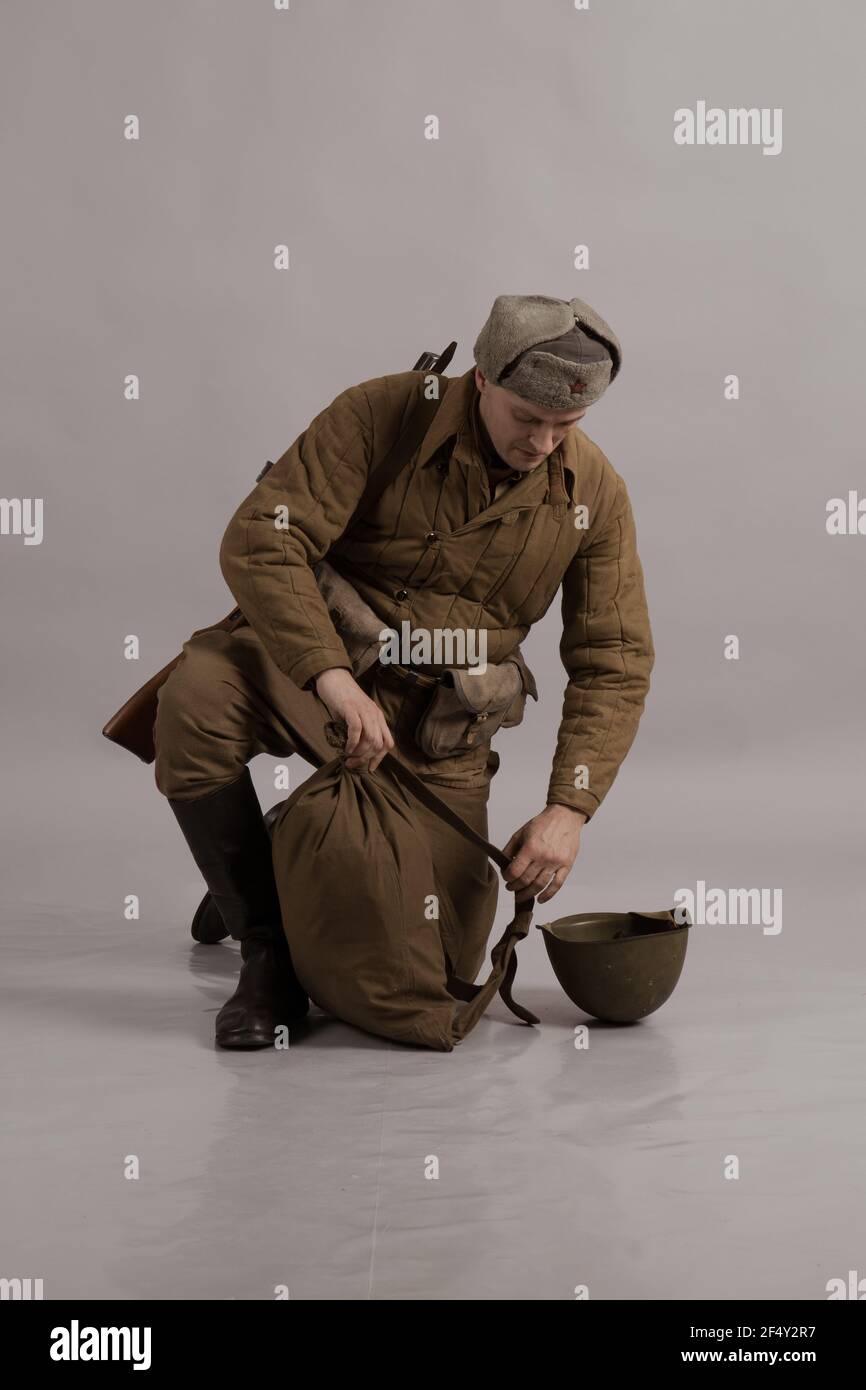 male actor in the winter military uniform of an officer of the Red Army ...