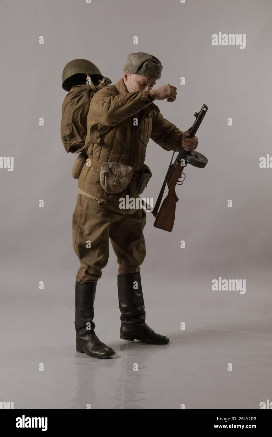 male actor in the winter military uniform of an officer of the Red Army ...
