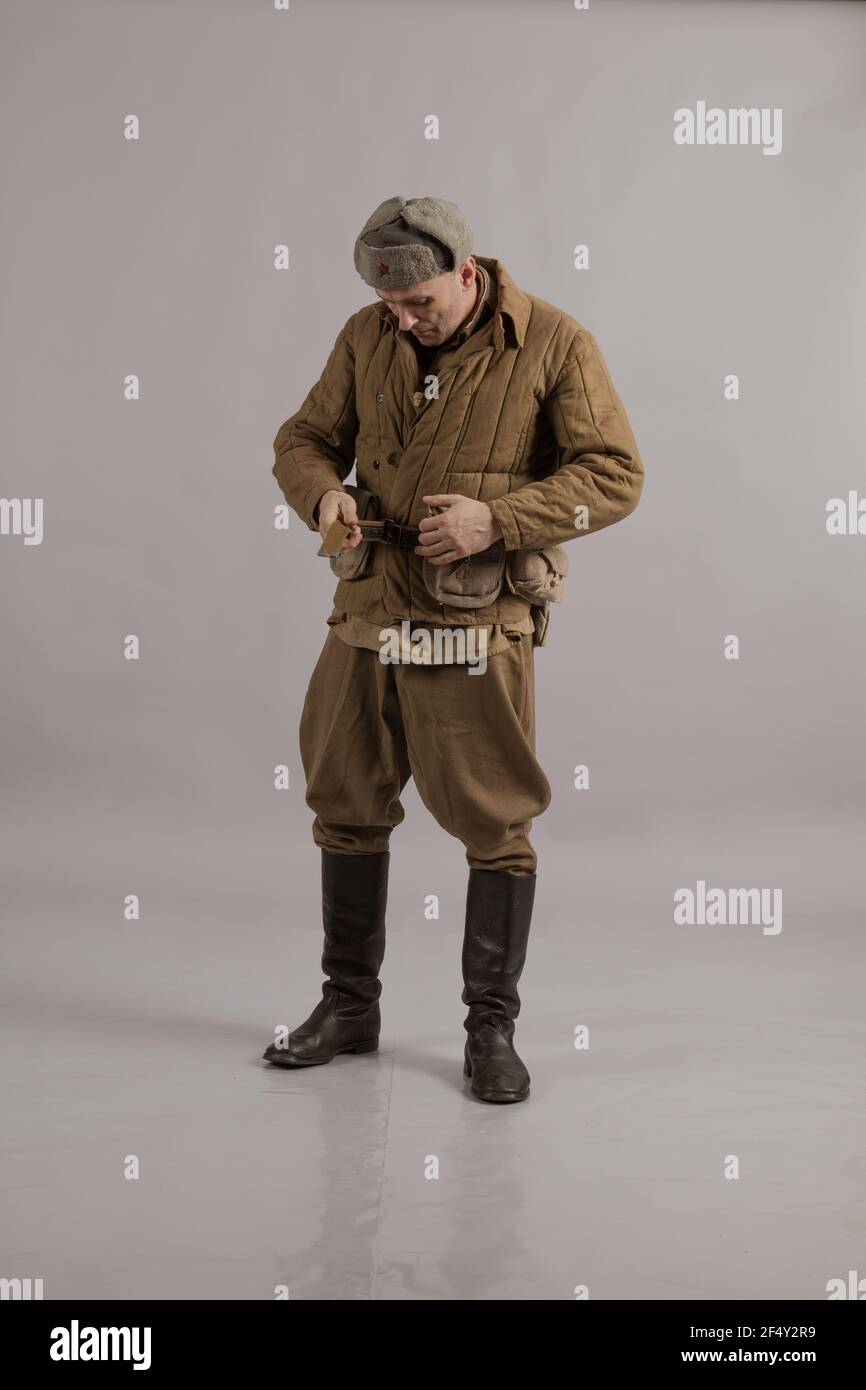 male actor in the winter military uniform of an officer of the Red Army ...