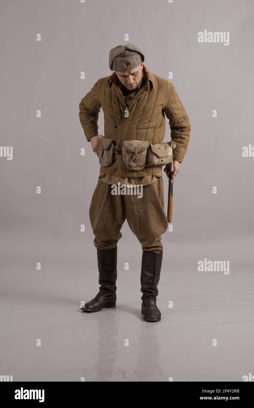 male actor in the winter military uniform of an officer of the Red Army ...