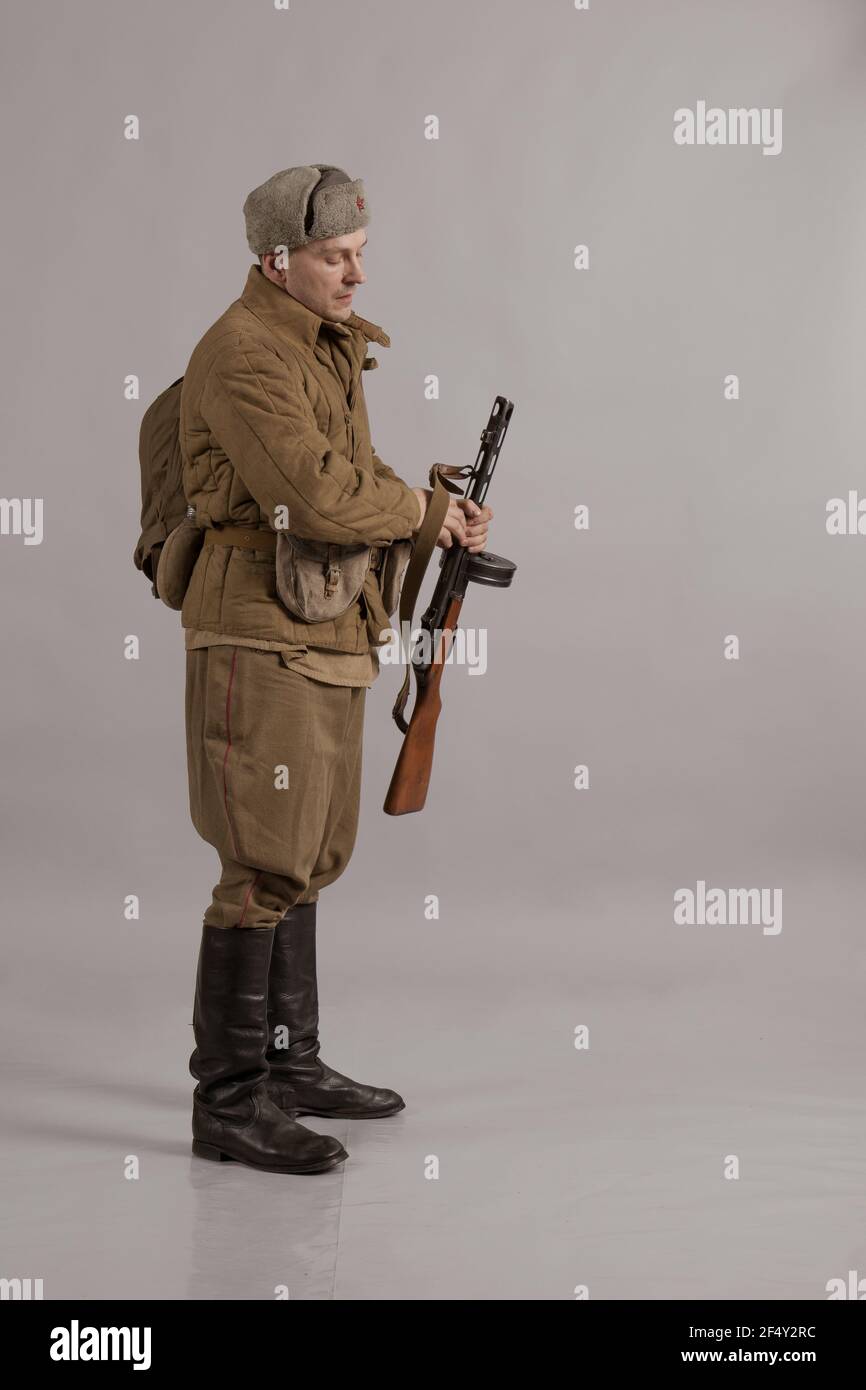 male actor in the winter military uniform of an officer of the Red Army ...