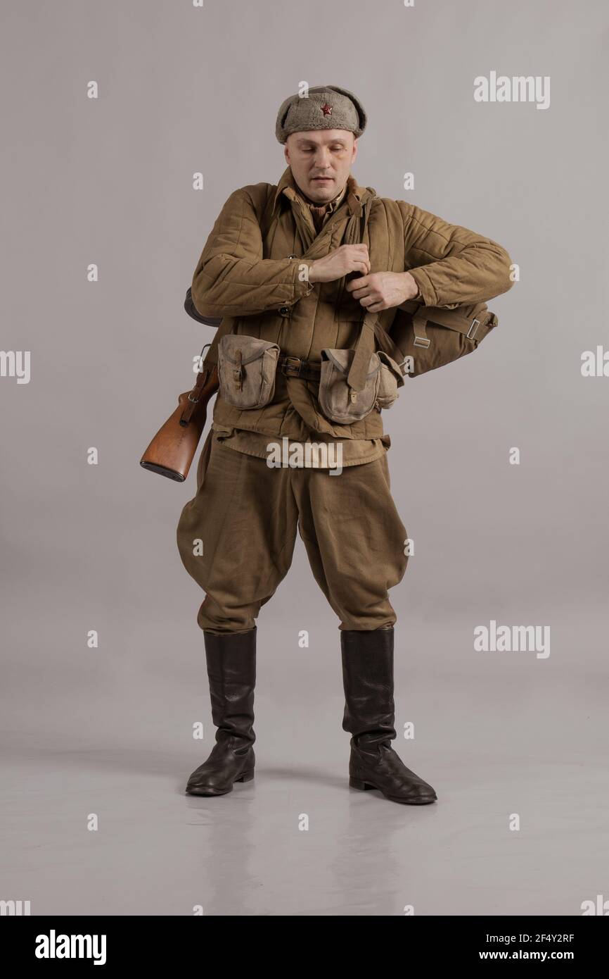 male actor in the winter military uniform of an officer of the Red Army ...