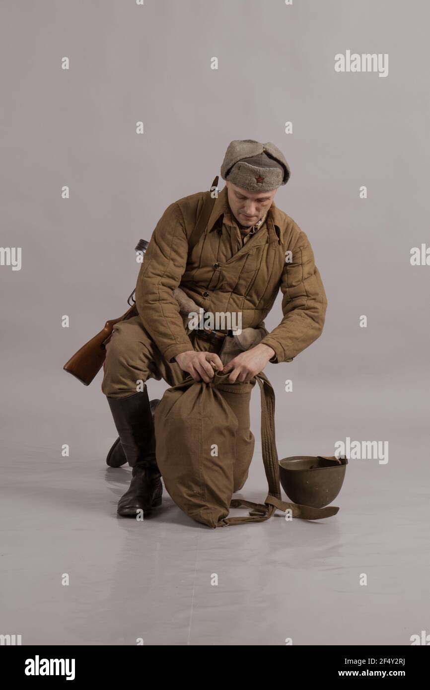 male actor in the winter military uniform of an officer of the Red Army ...