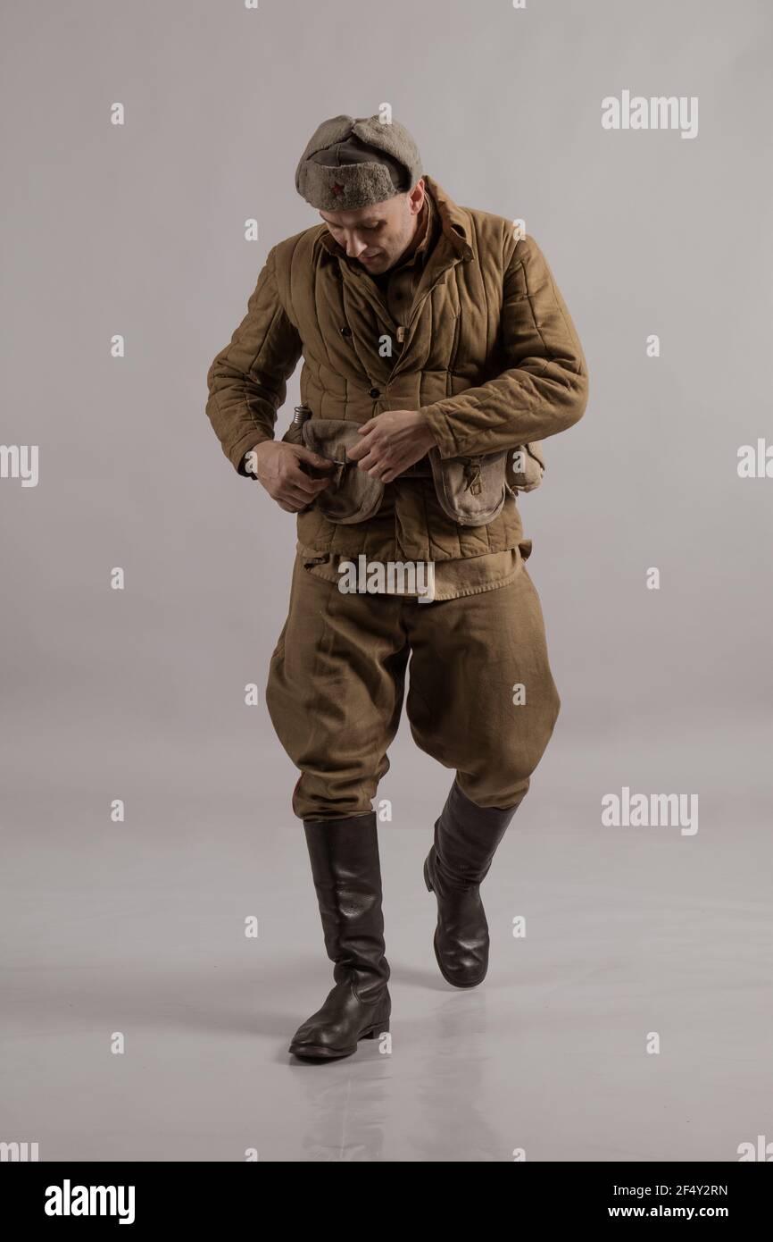 male actor in the winter military uniform of an officer of the Red Army ...