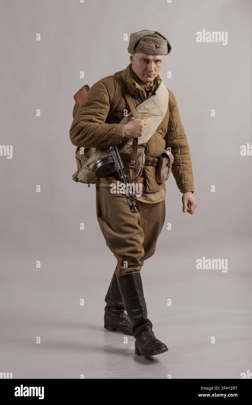 male actor in the winter military uniform of an officer of the Red Army ...
