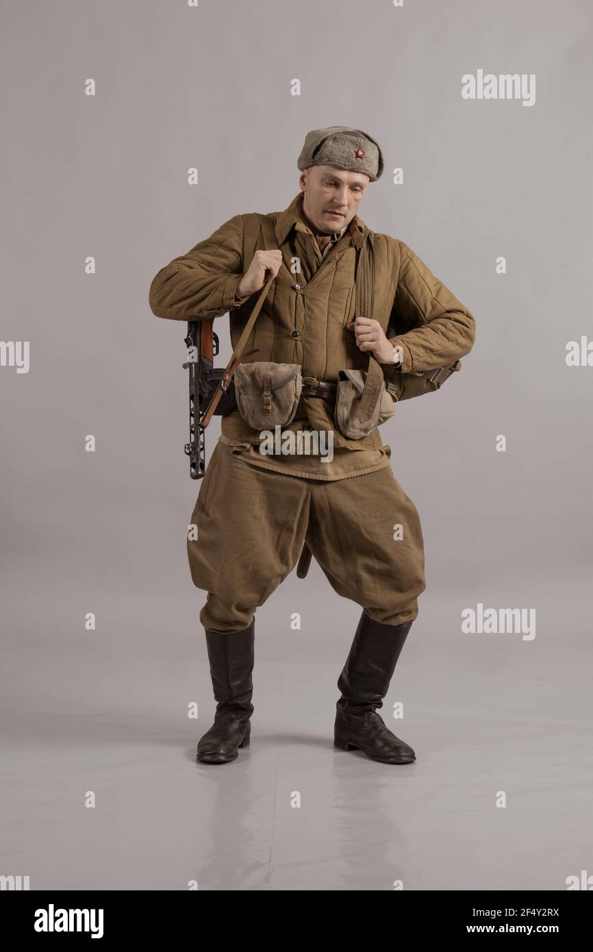 male actor in the winter military uniform of an officer of the Red Army ...
