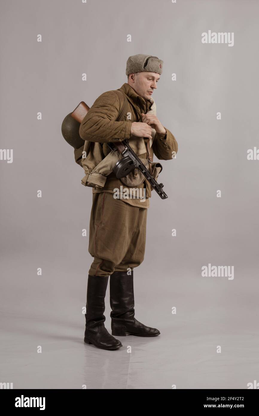 male actor in the winter military uniform of an officer of the Red Army ...