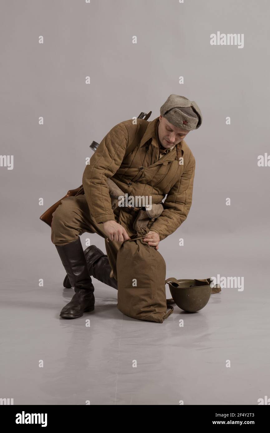 male actor in the winter military uniform of an officer of the Red Army ...