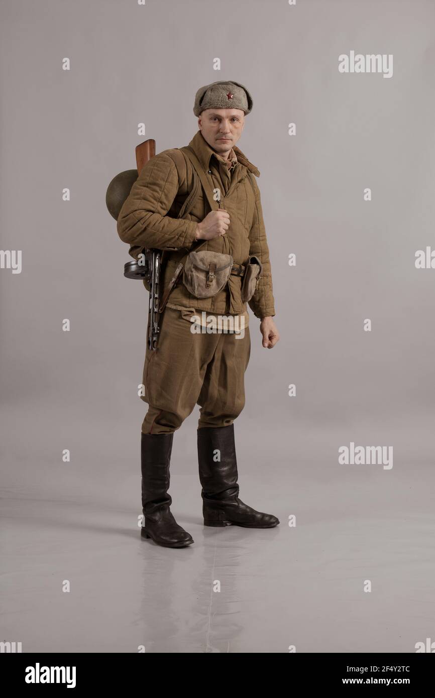 male actor in the winter military uniform of an officer of the Red Army ...