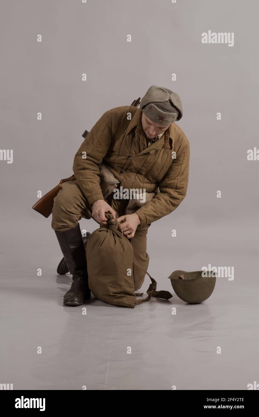 male actor in the winter military uniform of an officer of the Red Army ...