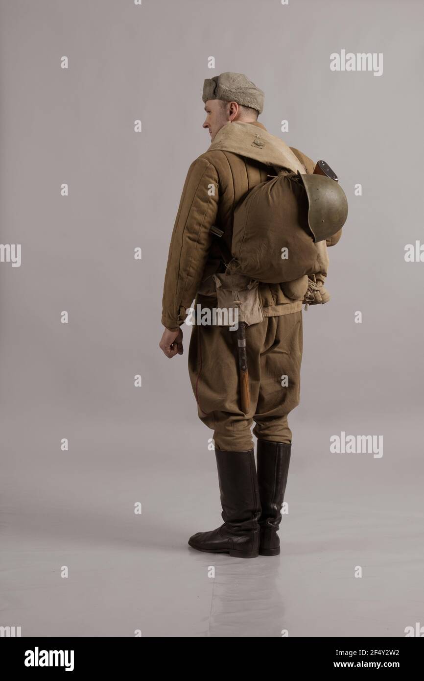 male actor in the winter military uniform of an officer of the Red Army ...
