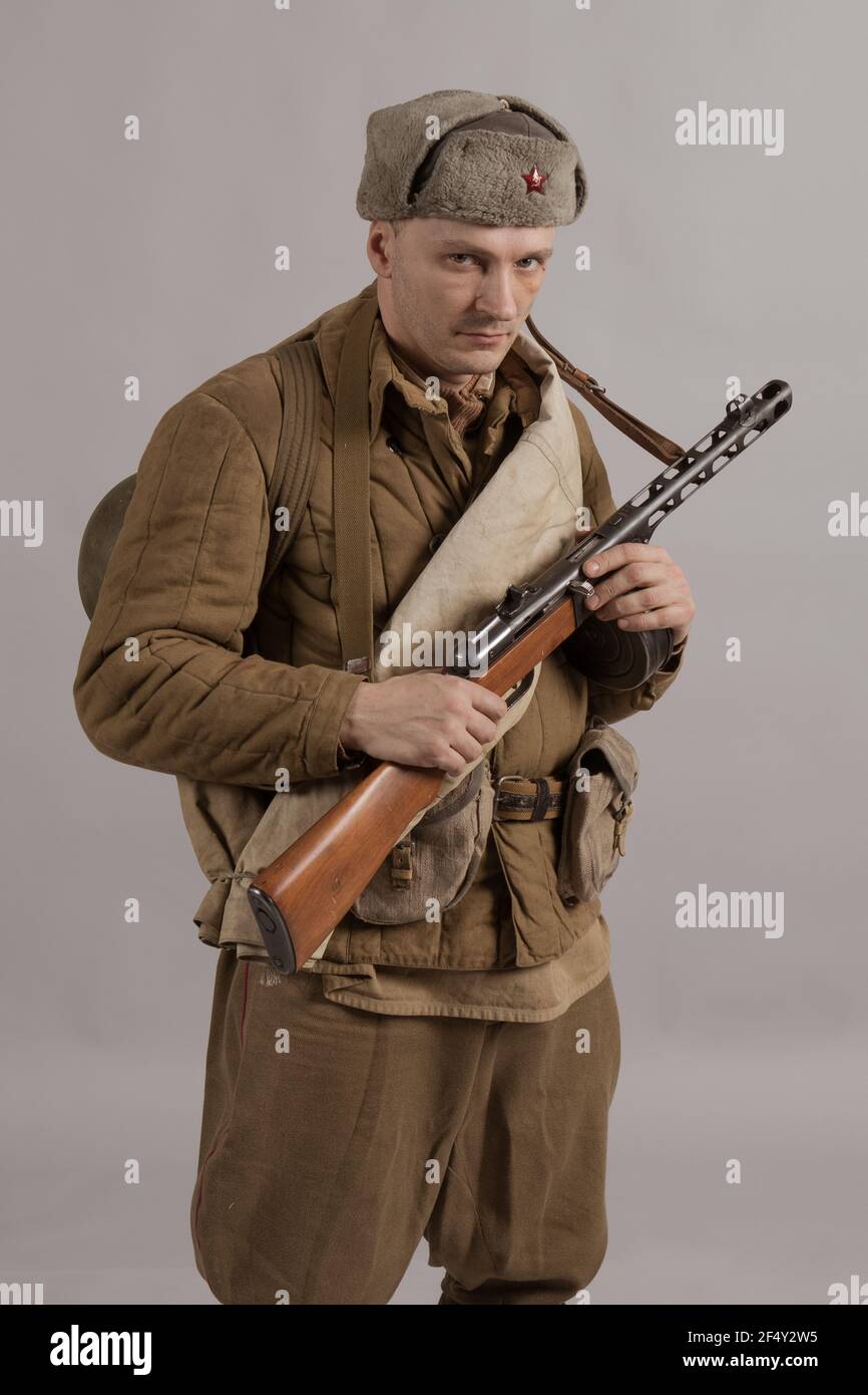 male actor in the winter military uniform of an officer of the Red Army ...