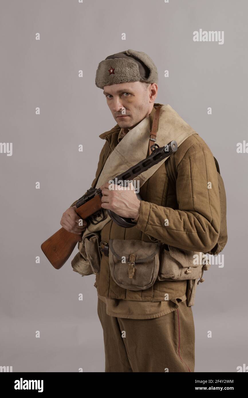 male actor in the winter military uniform of an officer of the Red Army ...