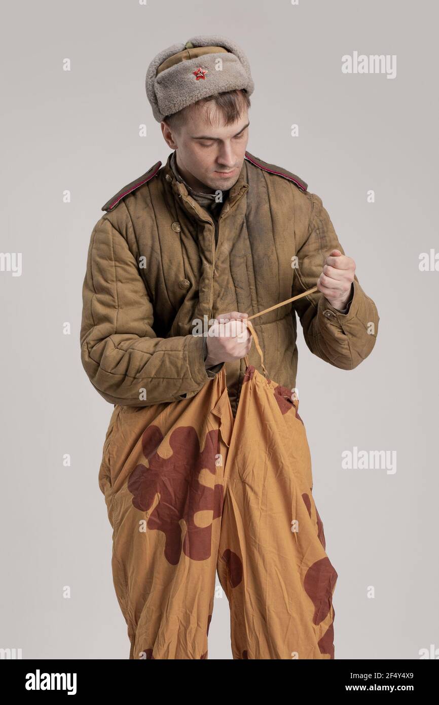 Actor man in an old military uniform and camouflage clothing summer ...