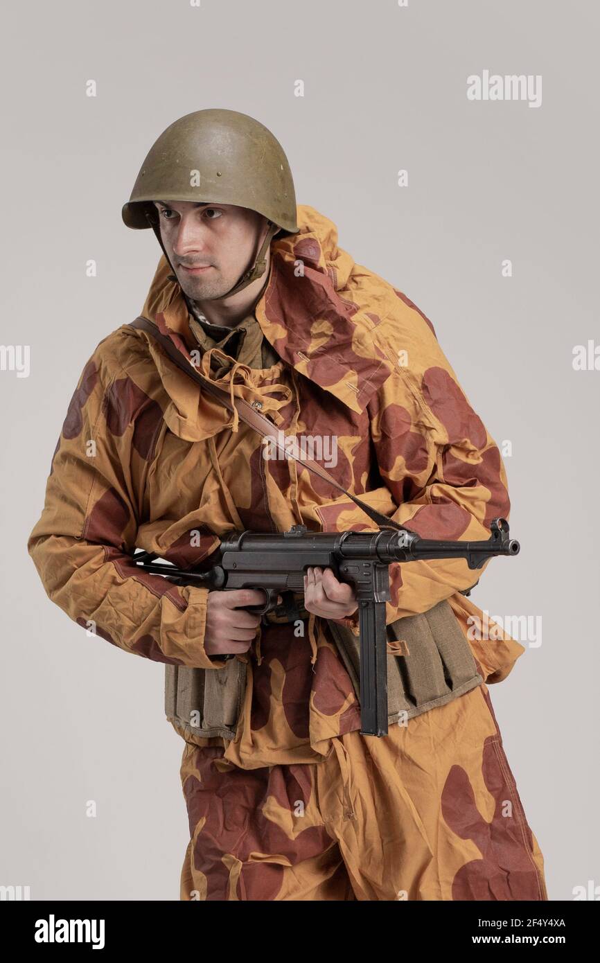 Actor man in an old military uniform and camouflage clothing summer ...