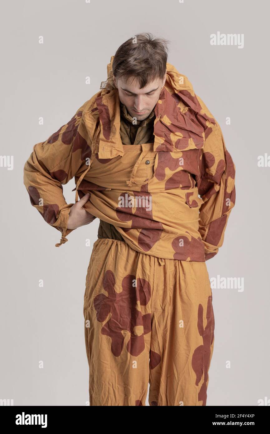 Actor man in an old military uniform and camouflage clothing summer ...