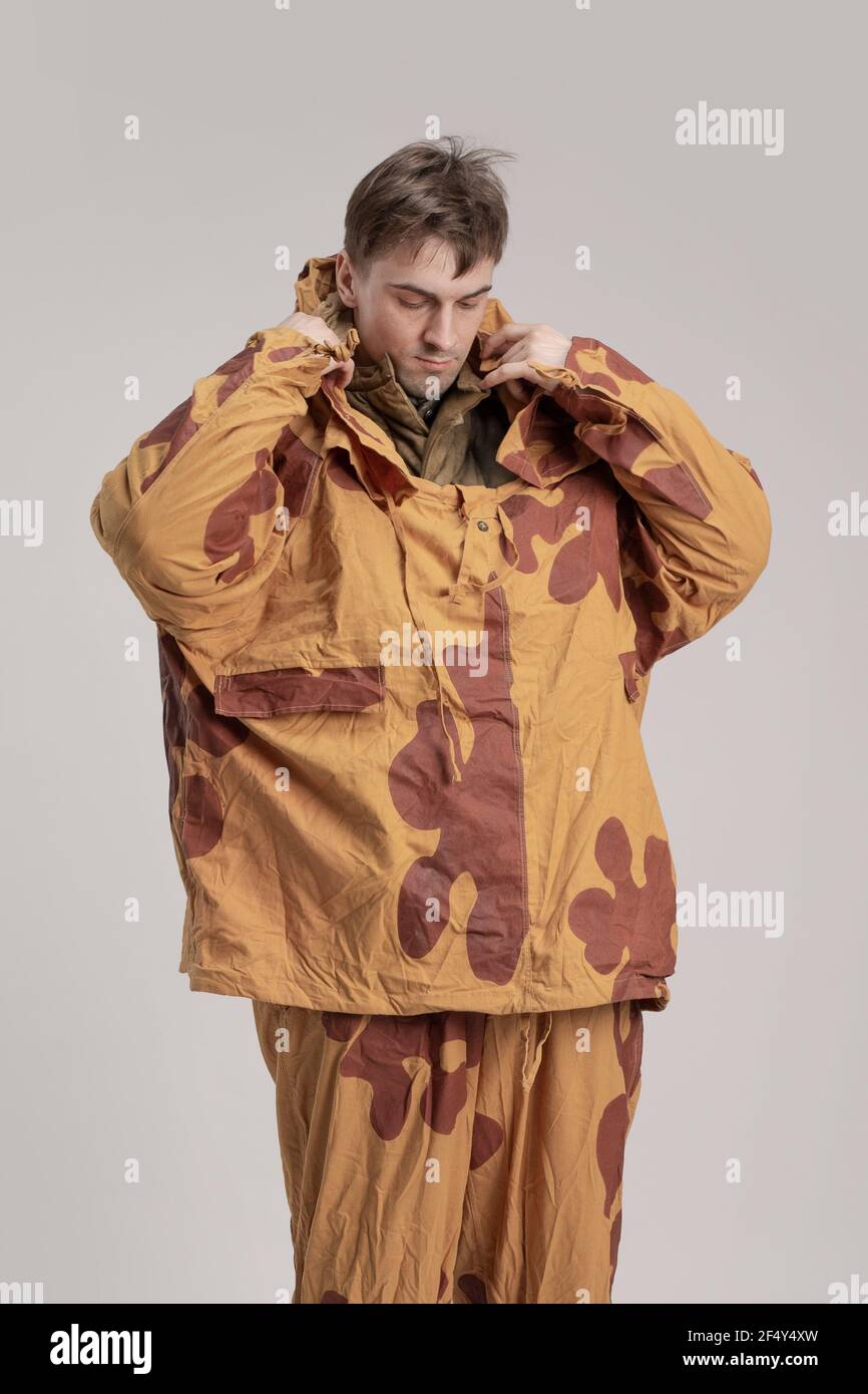 Actor man in an old military uniform and camouflage clothing summer ...