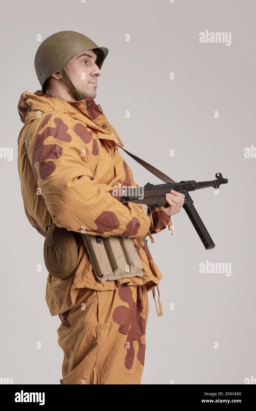 Actor man in an old military uniform and camouflage clothing summer ...