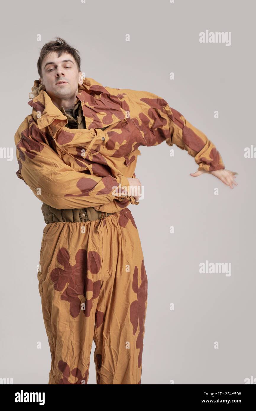 Actor man in an old military uniform and camouflage clothing summer ...