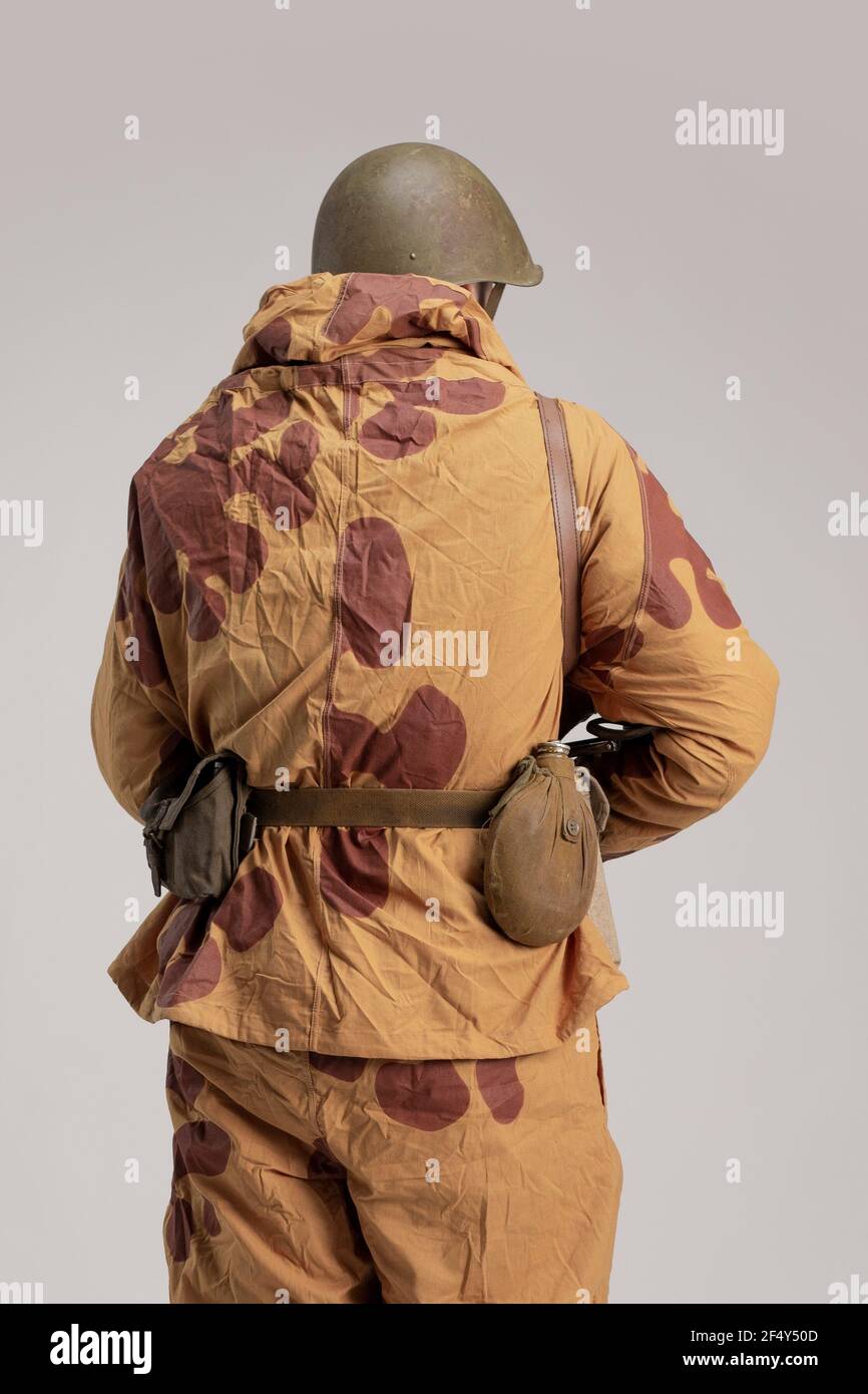 Actor man in an old military uniform and camouflage clothing summer ...