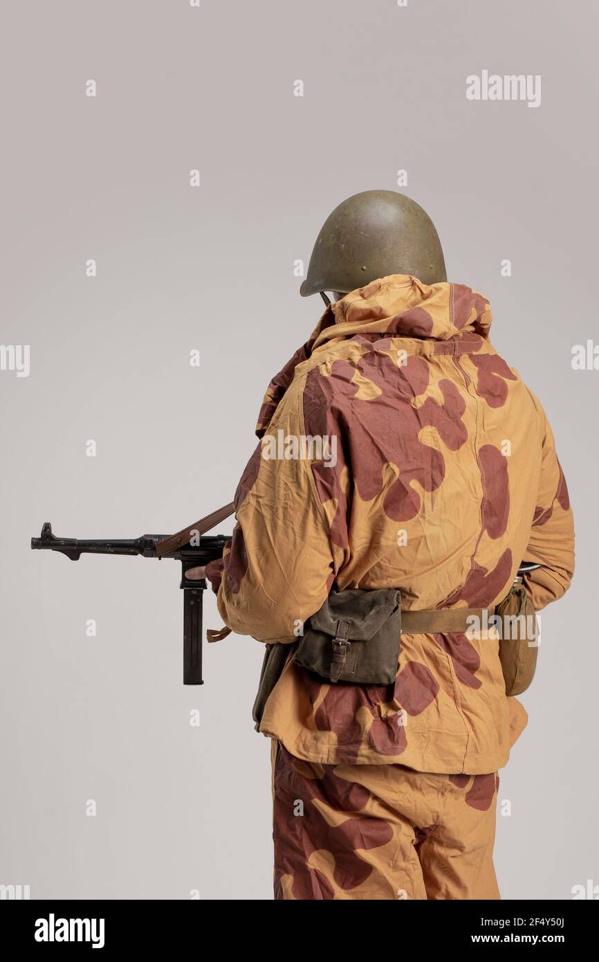 Actor man in an old military uniform and camouflage clothing summer ...