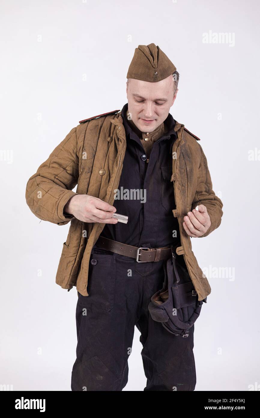 Portrait of a male actor in military uniform of an Russian tankman of ...