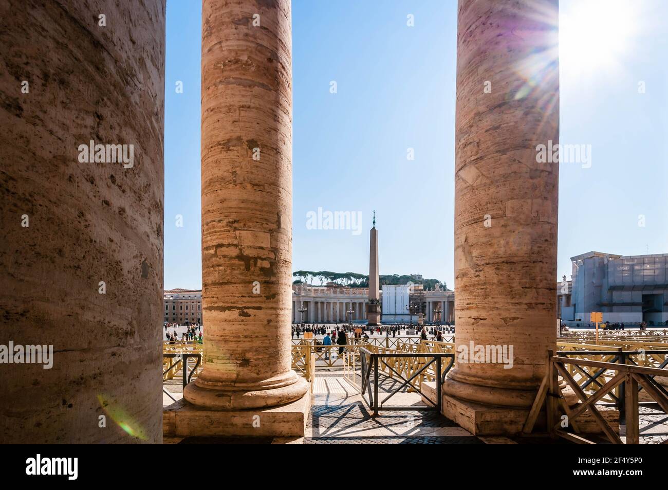 St. Peter's Square seen between the columns of Bernini at the Vatican ...