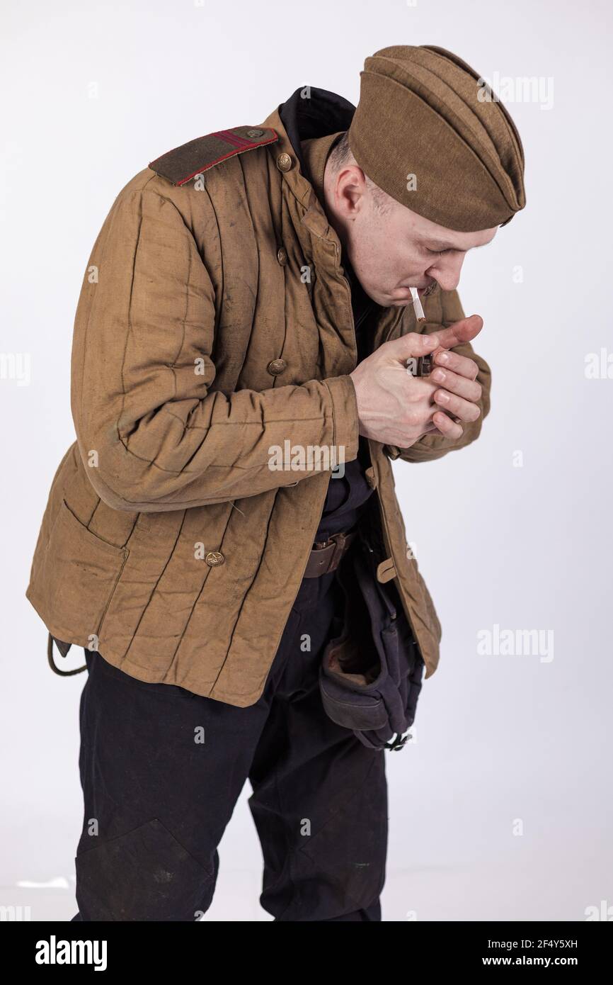 Portrait of a male actor in military uniform of an Russian tankman of ...