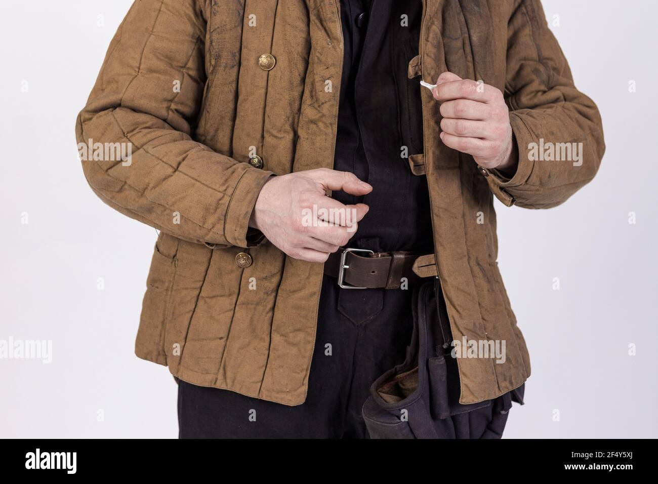 Portrait of a male actor in military uniform of an Russian tankman of ...
