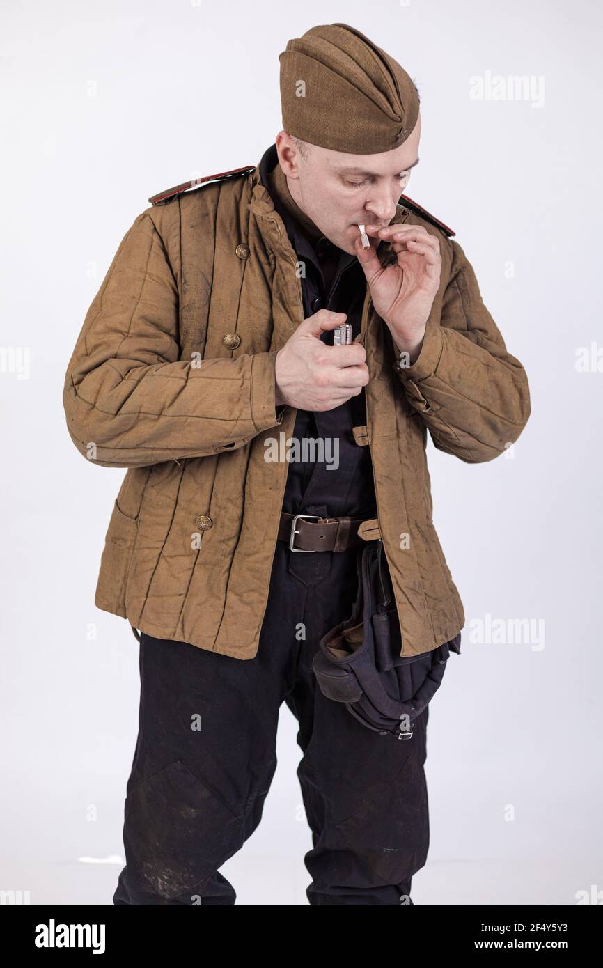 Portrait of a male actor in military uniform of an Russian tankman of ...