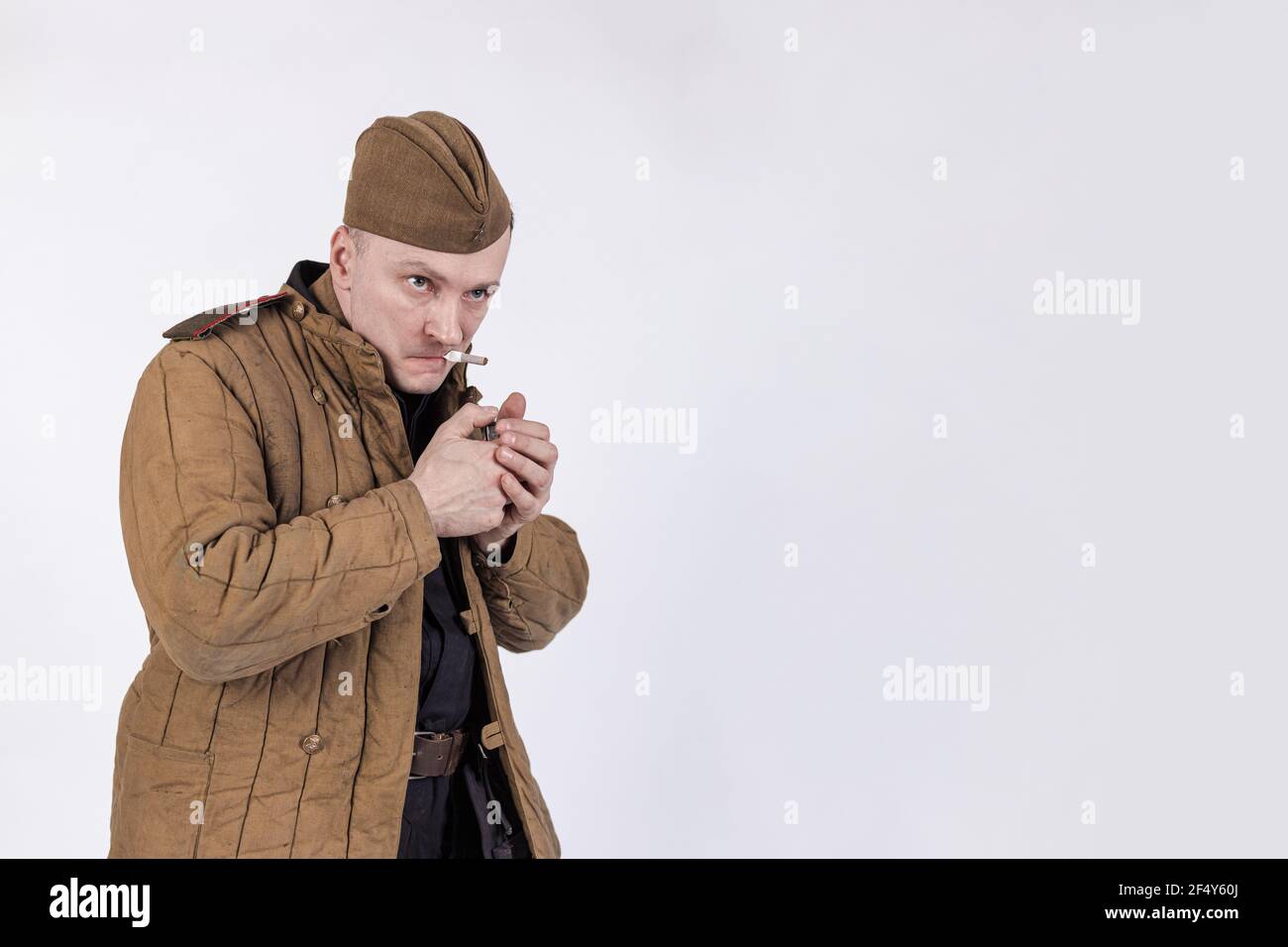 Portrait of a male actor in military uniform of an Russian tankman of ...