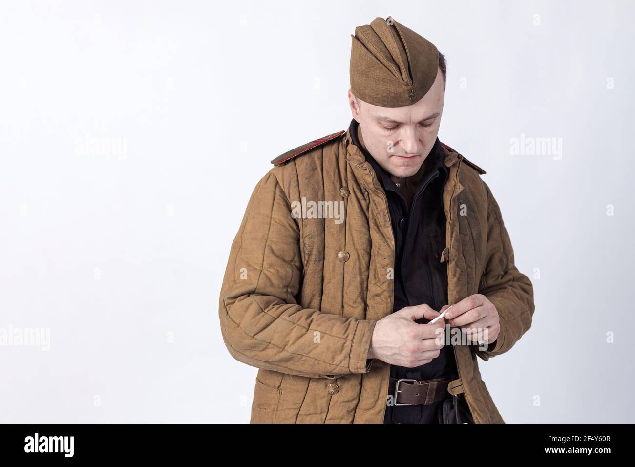 Portrait of a male actor in military uniform of an Russian tankman of ...
