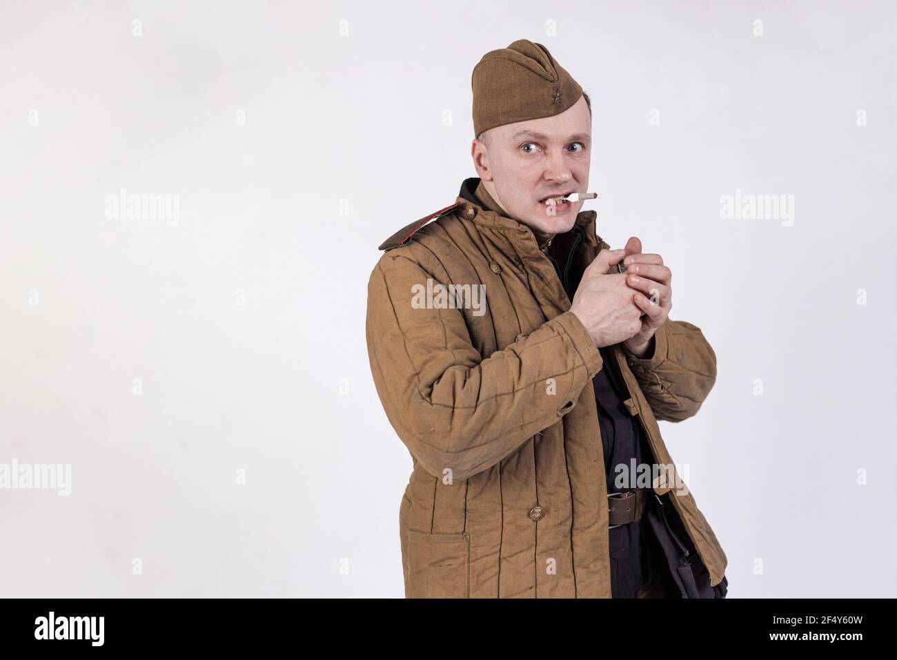 Portrait of a male actor in military uniform of an Russian tankman of ...