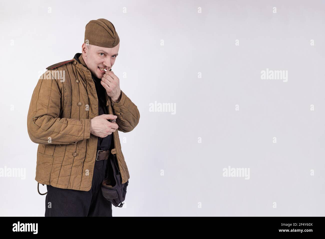 Portrait of a male actor in military uniform of an Russian tankman of ...