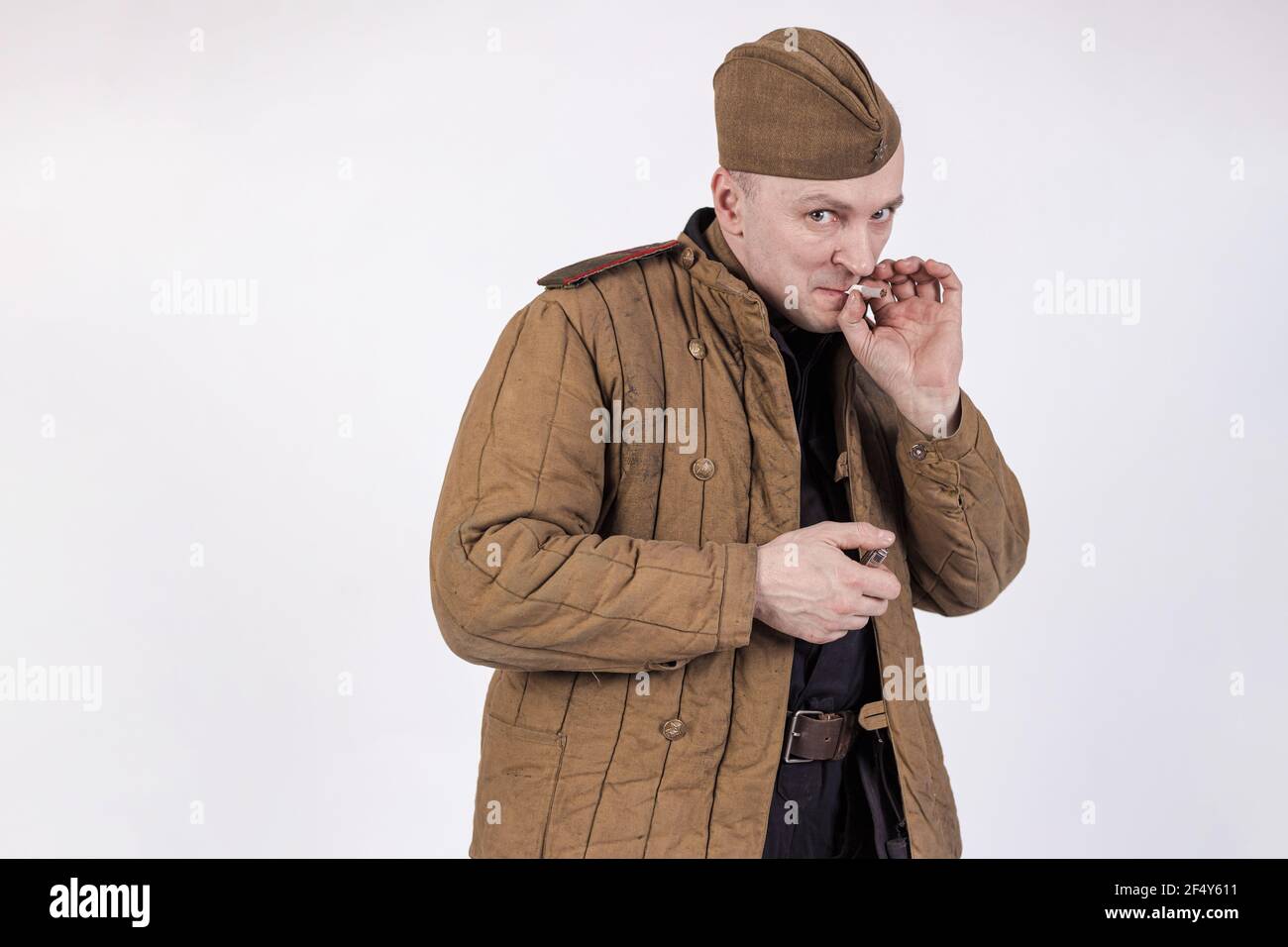 Portrait of a male actor in military uniform of an Russian tankman of ...