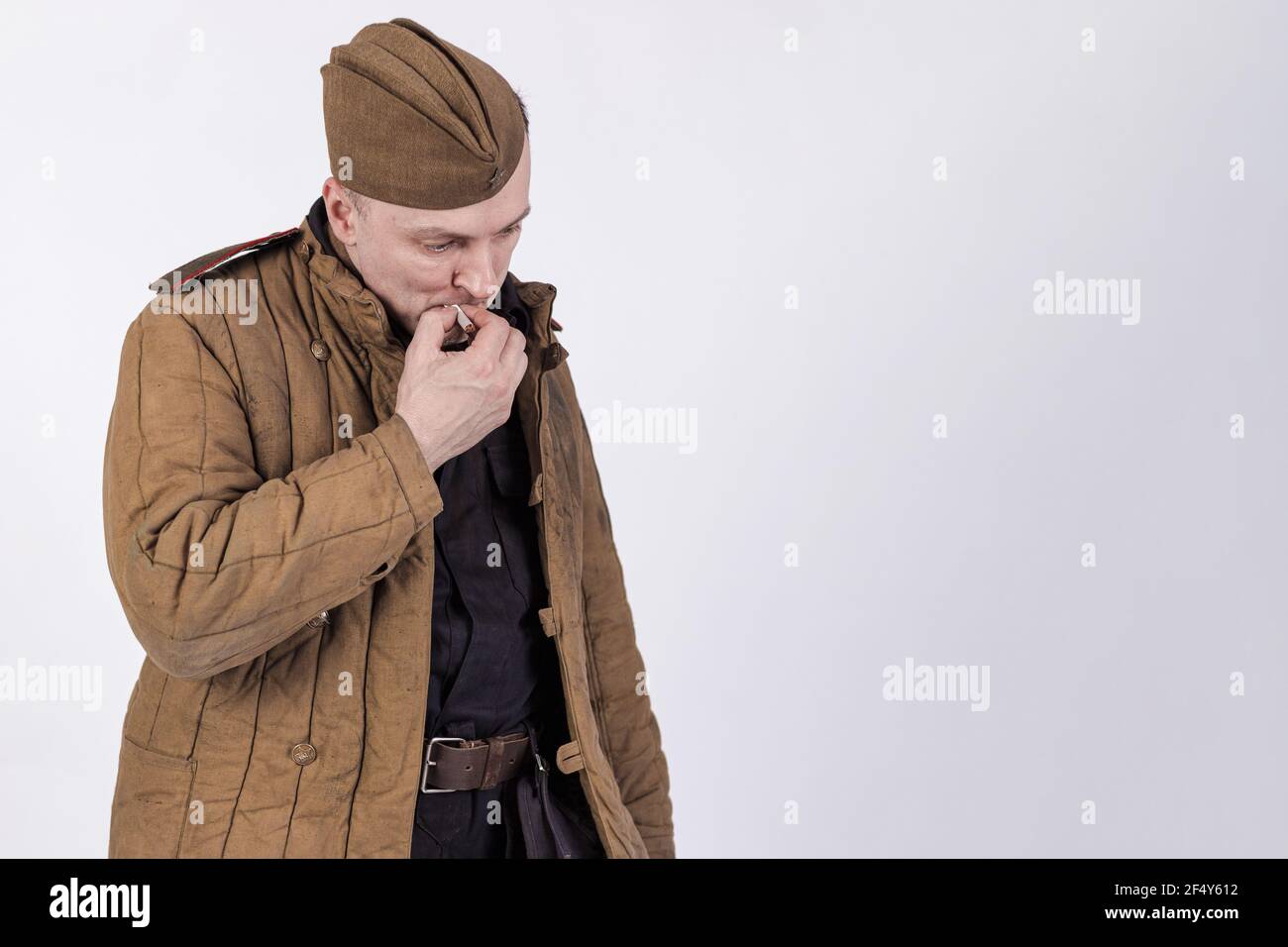 Portrait of a male actor in military uniform of an Russian tankman of ...
