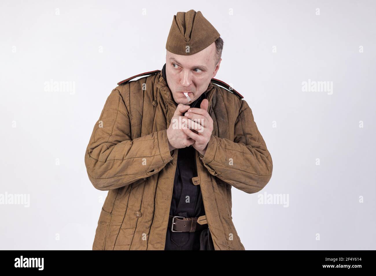 Portrait of a male actor in military uniform of an Russian tankman of ...