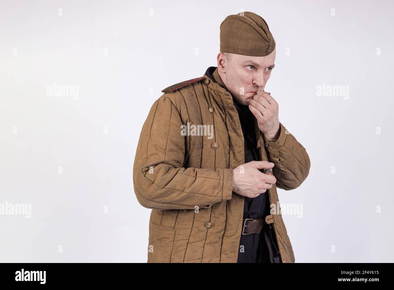 Portrait of a male actor in military uniform of an Russian tankman of ...