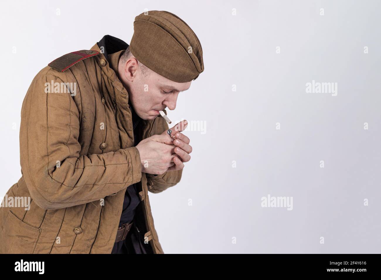 Portrait of a male actor in military uniform of an Russian tankman of ...