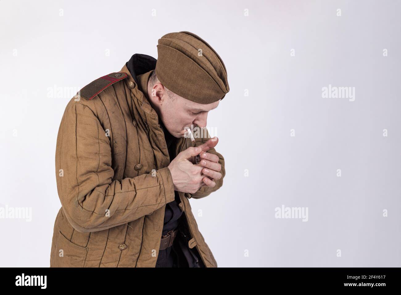 Portrait of a male actor in military uniform of an Russian tankman of ...
